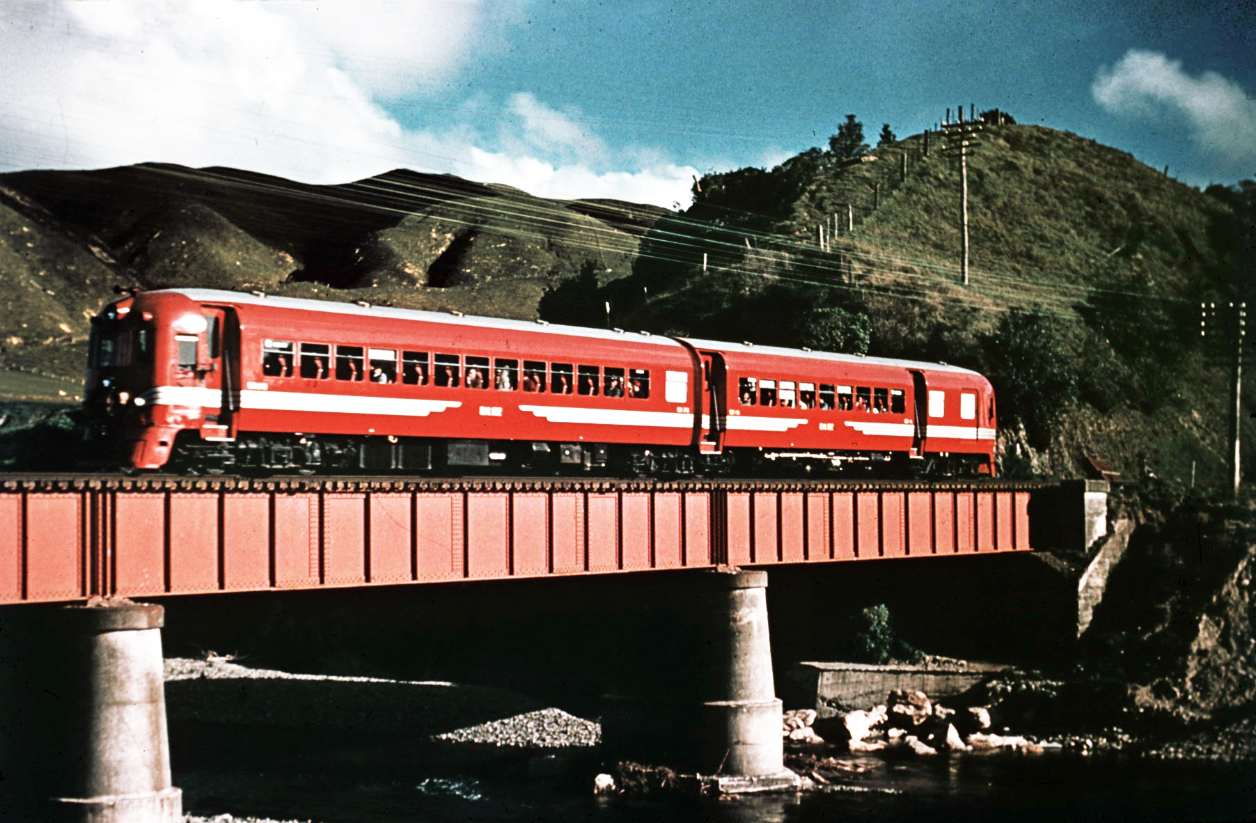 an articulated railcar crosses the Waikanae River bridge, late 1955 ...