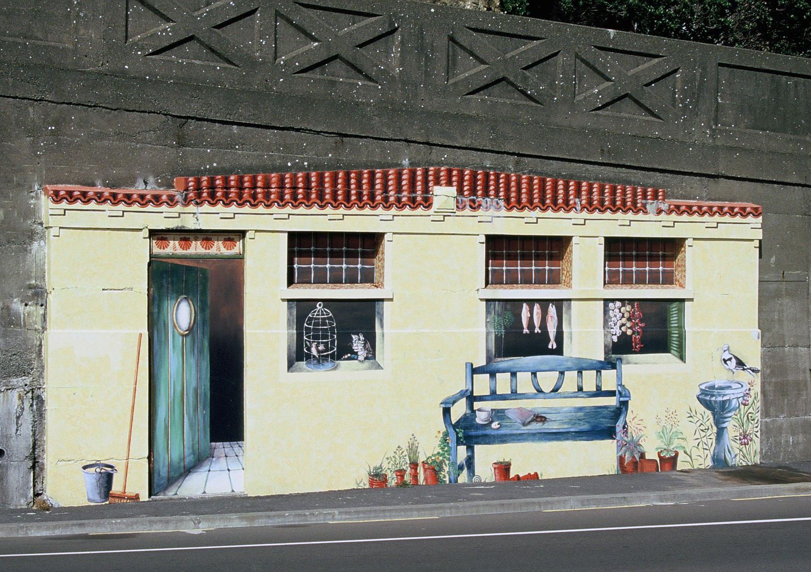 an old loo in the wall made to look like an old house in the wall ...